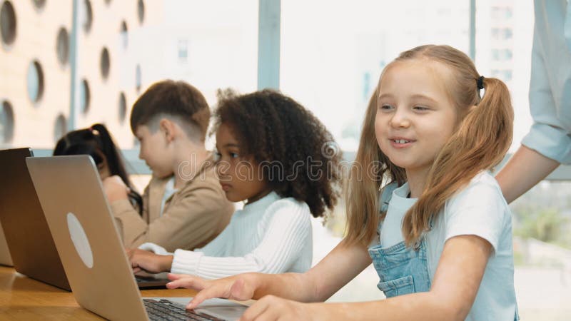 Student Use Laptop Writing Code while Teacher Explain about Program ...