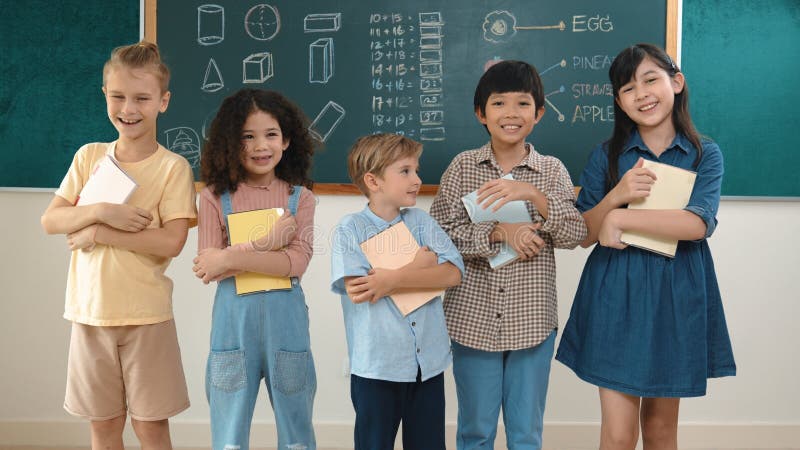 Multicultural Student Looking at Camera while Standing at Classroom ...