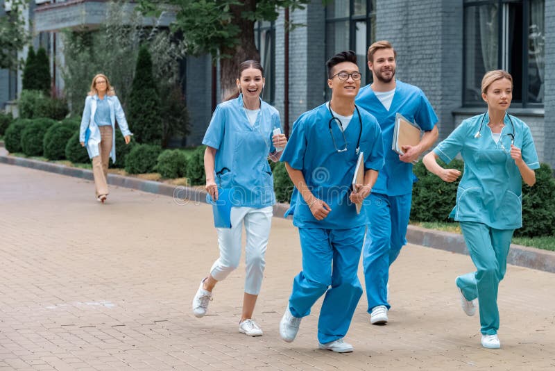 Multicultural Students Running Near Medical Stock Image - Image of ...