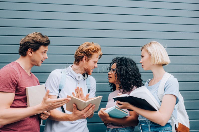 Multicultural Students Talking while Standing with Stock Image - Image ...