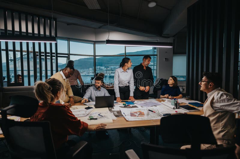 Multicultural Team Collaborating in a Modern Office Environment Stock ...