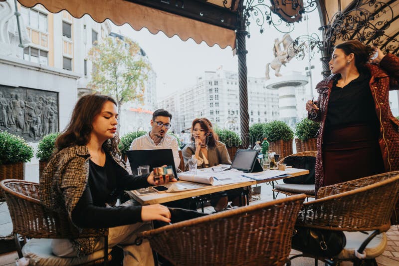 Multicultural Team Collaborating in Outdoor Cafe Setting Stock Image ...