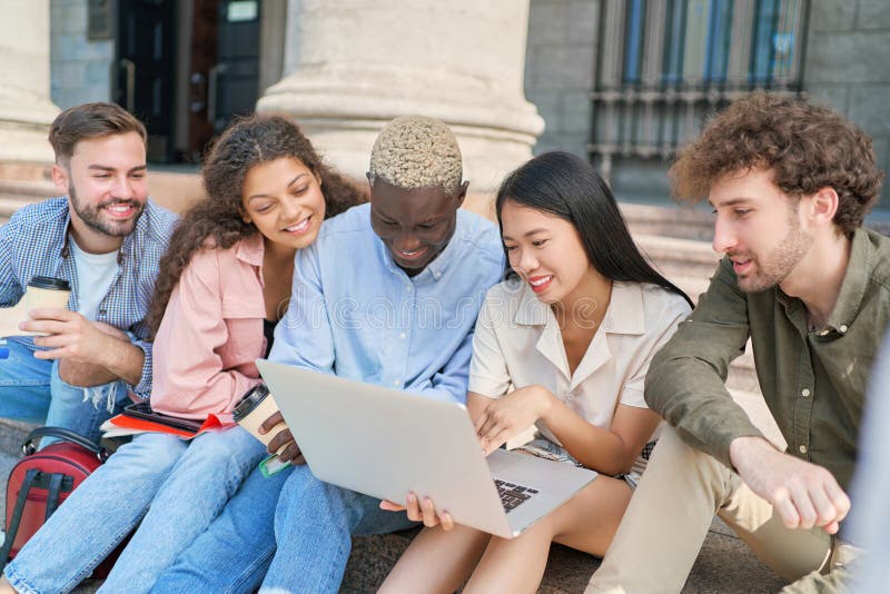 Multicultural Team of Students Looking at the Laptop Screen. Stock ...