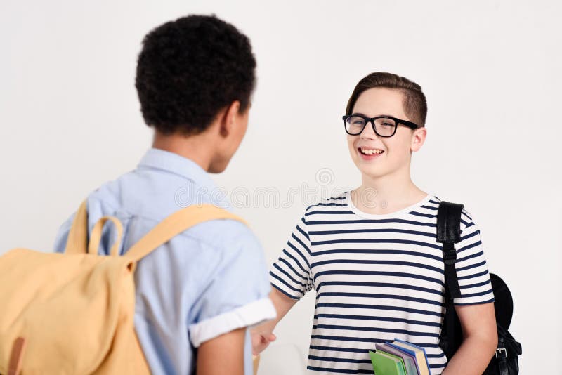 Multicultural Teen Boys with Bags Talking Stock Photo - Image of ...
