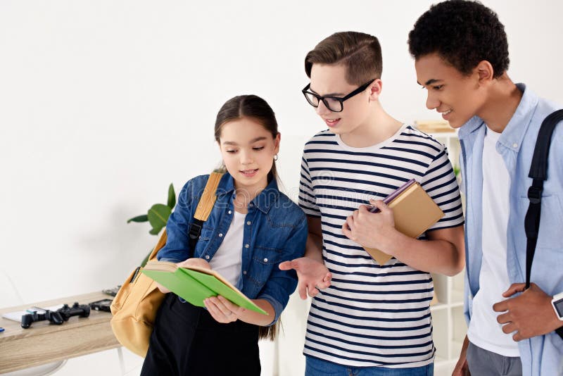 Multicultural Teenagers Studying with Laptop and Computer Motherboard ...