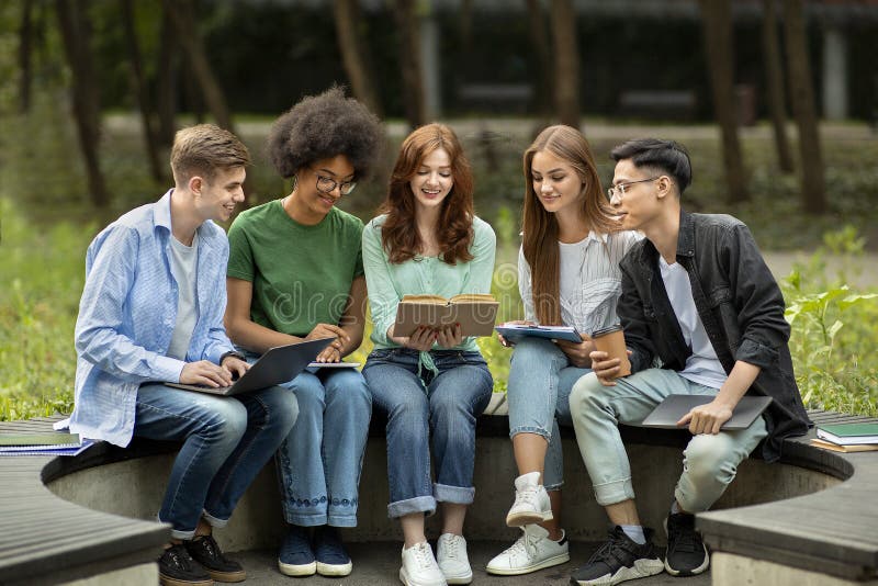 Multicultural University Students Studying Outdoors with Books and ...