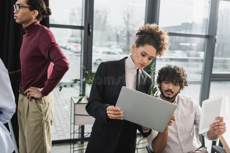 Multiethnic Business People Using Devices Near Stock Photo - Image of ... Multiethnic Business People Using Devices Near Stock Photo - Image of ...