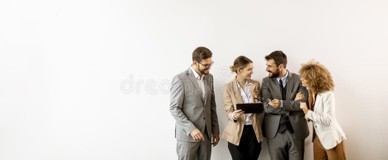 Multiethnic Business People Using Digital Tablet while Standing by the ...