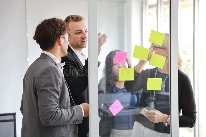 Multiethnic Business People Using Post it Notes for Brainstorming or ...