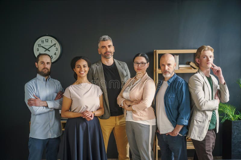 Multiethnic Business Team Against Backdrop of Office Environment ...