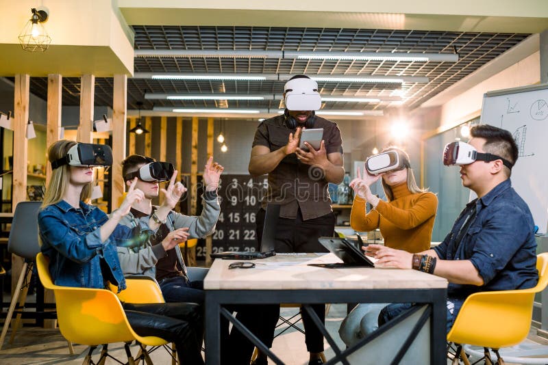 Multiethnic Business Team Using Virtual Reality Headset in Office ...