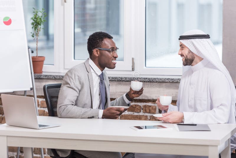 Multiethnic Businessmen Sitting and Drinking Coffee Stock Image - Image ...