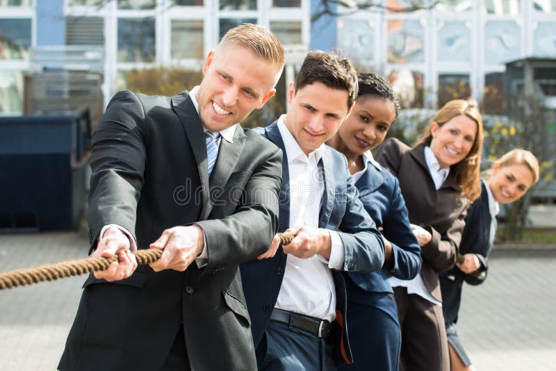 Multiethnic Businesspeople Playing Tug of War Stock Photo - Image of ...
