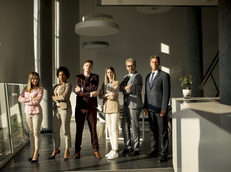 Multiethnic Corporate Staff Standing in Row and Looking in the Camera ...