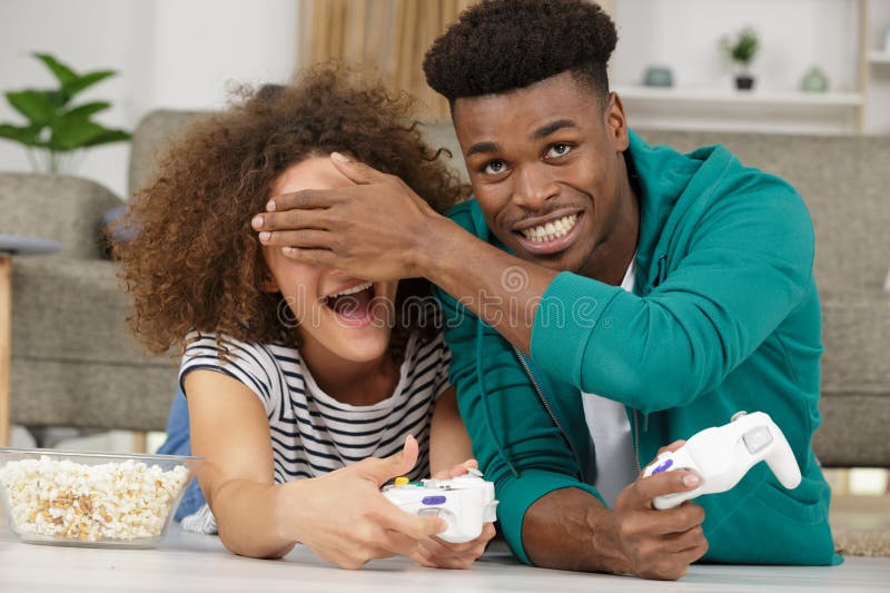Multiethnic Couple Playing Video Game Together at Home Stock Photo ...