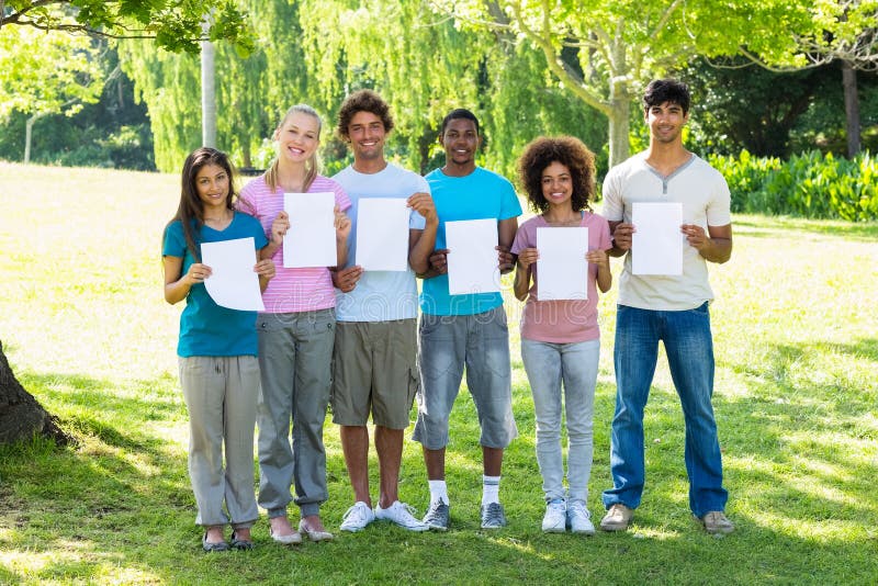 Multiethnic Friends Holding Blank Papers Stock Image - Image of people ...