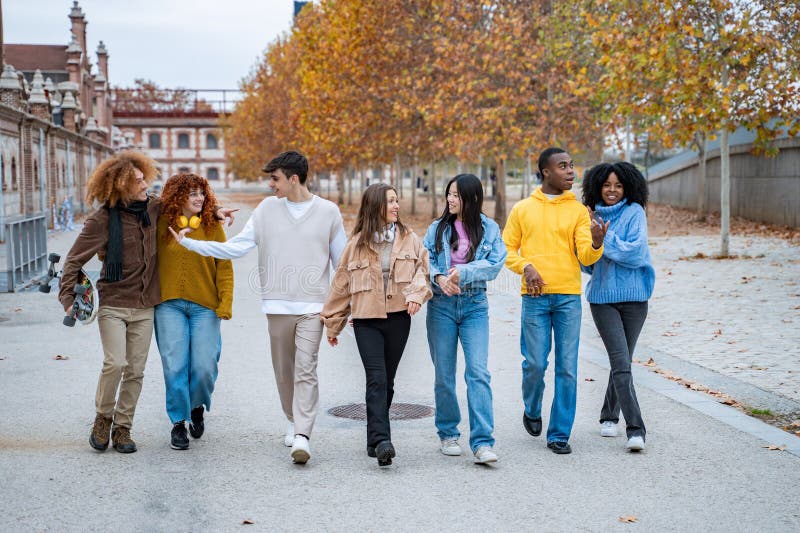 Multiethnic Friends Walking Together Outdoors. Stock Photo - Image of ...