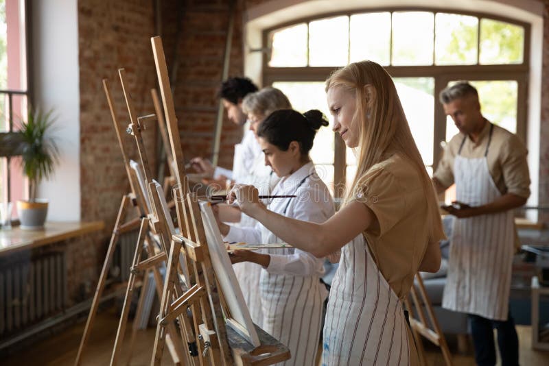 Multiethnic Group of Art School Students Drawing in Paints Stock Photo ...
