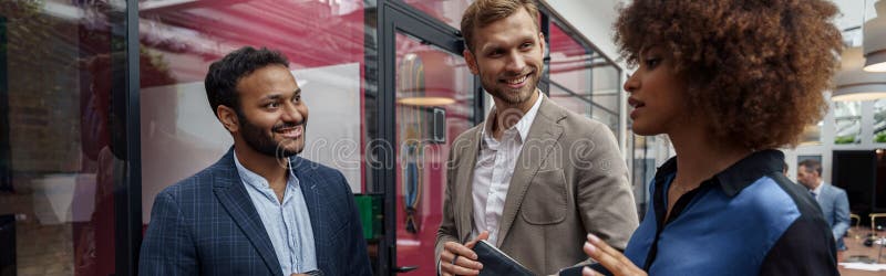 Multiethnic Group of Business People Talking in Office during Break ... Multiethnic Group of Business People Talking in Office during Break ...