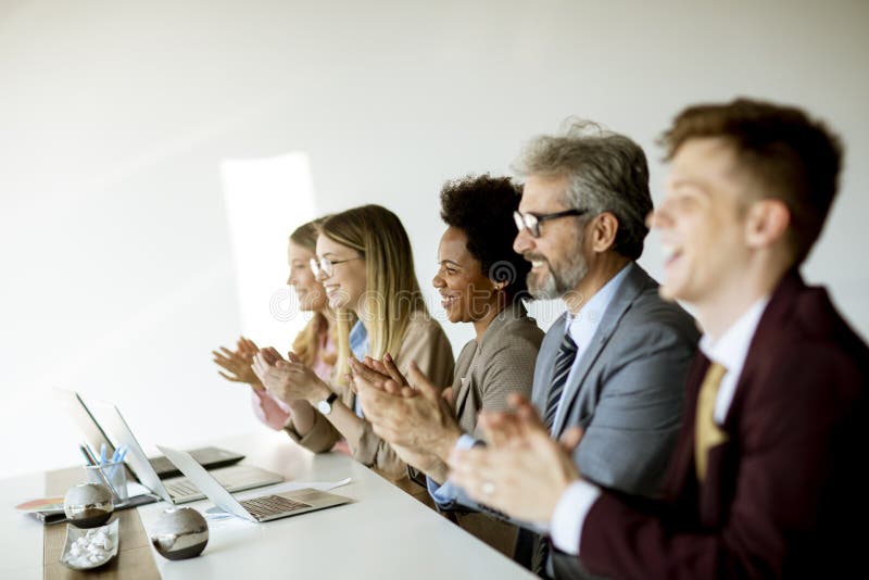 Multiethnic Group of Business People Working Together and Applauding in ... Multiethnic Group of Business People Working Together and Applauding in ...