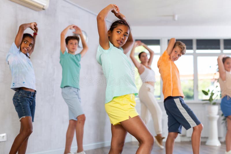 Multiethnic Group of Children in Casual Wear Training Hip Hop Movements ... Multiethnic Group of Children in Casual Wear Training Hip Hop Movements ...