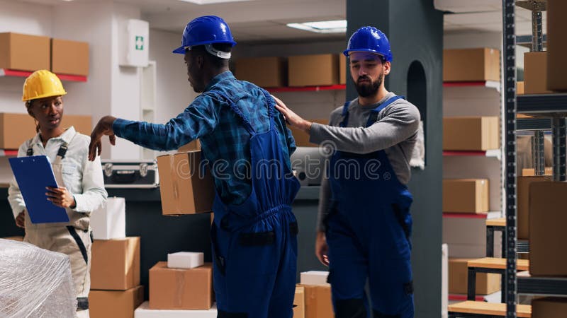 Multiethnic Group of Employees Working with Products Stock Image ...