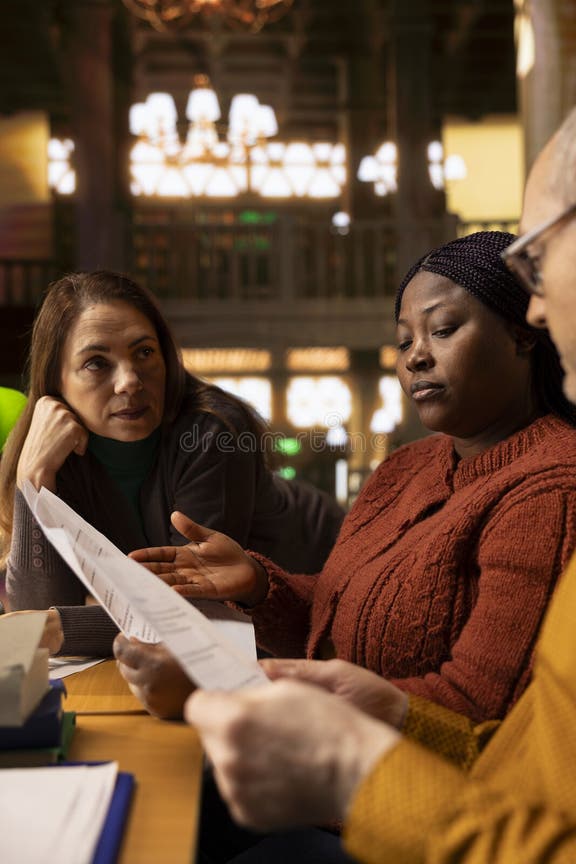 Multiethnic Group of Mature Scholars Working on Their Thesis Paperwork ...