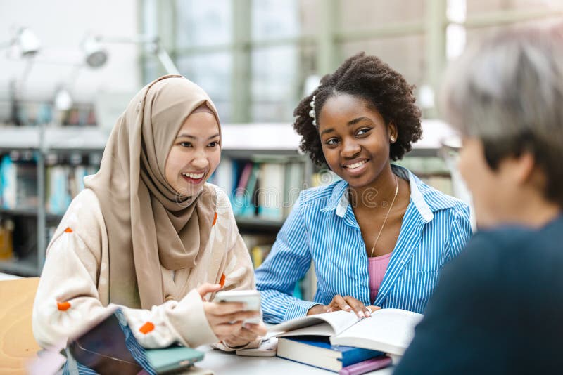 Group of Multiethnic Students in a Library Stock Photo - Image of exam ...