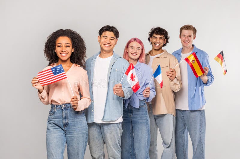 Multiethnic Group of Young Adults Holding Flags of Different Countries ...