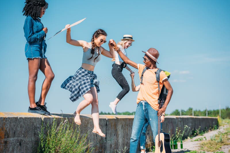 Multiethnic Group of Young Friends Jumping of Stock Image - Image of ...