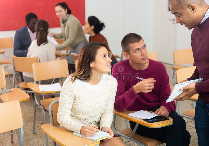 Adult Students in Cooperation with Their School Assignment Stock Image ...