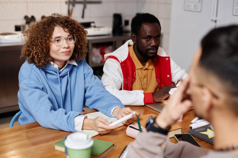 Multiethnic Group of Young Students Doing Homework in College Dorm ...
