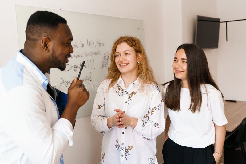 Multiethnic Happy Students and Black Teacher Study Foreign Languages ...