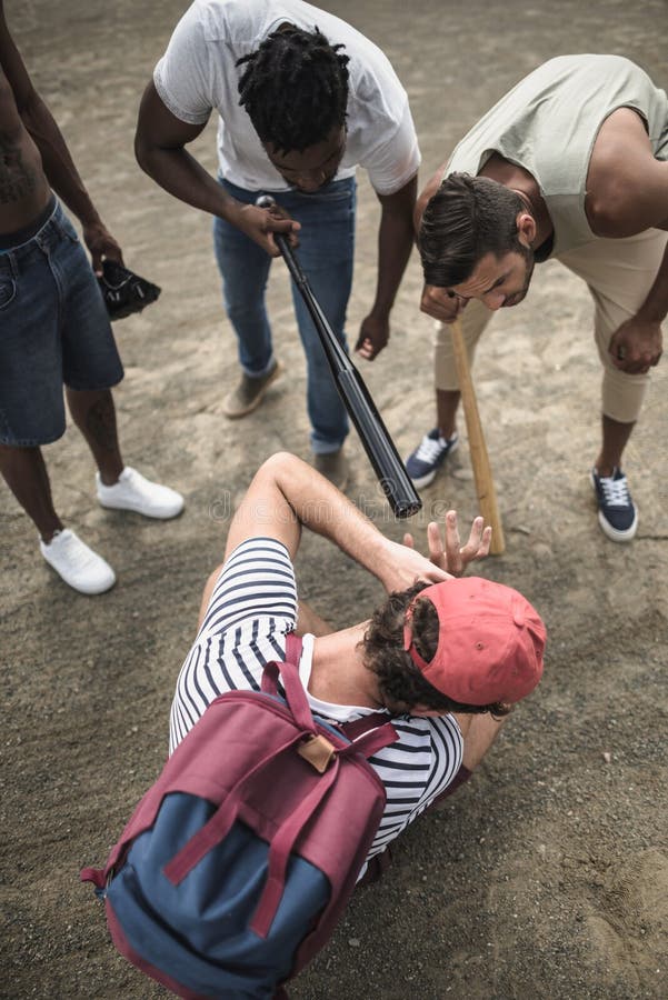 Multiethnic Men Attacking Other One with Baseball Bats Stock Photo ...