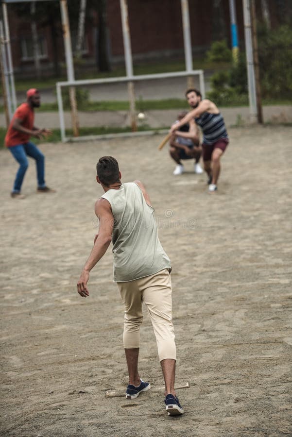 Multiethnic Men Playing Baseball on Court Stock Photo - Image of ...