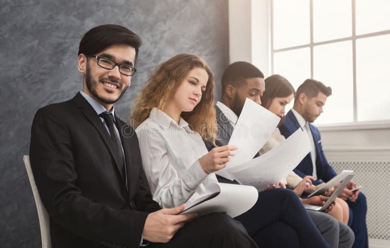 Multiracial People Waiting in Queue Preparing for Job Interview Stock ...