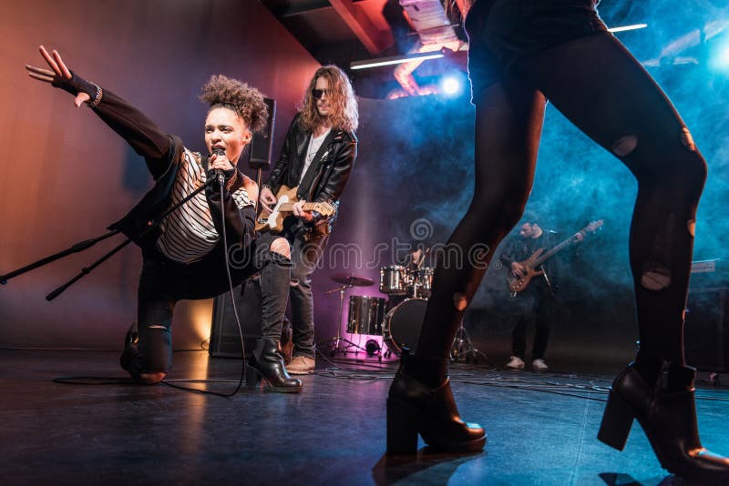 Multiethnic Rock and Roll Band Performing Concert on Stage Stock Photo ...