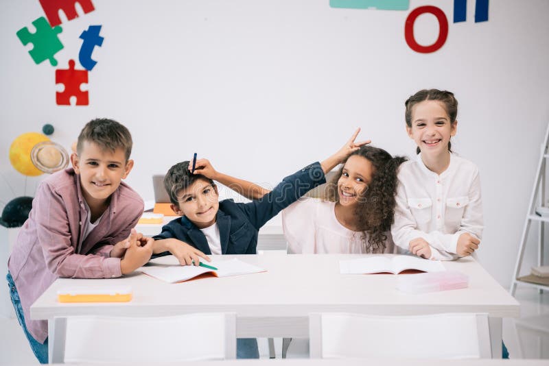 Multiethnic Students Having Fun and Smiling at Camera in Classroom ...