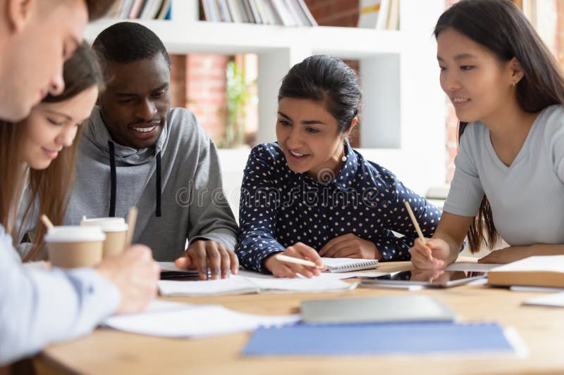 Multiethnic Students Work on Group Project in Classroom Stock Image ...
