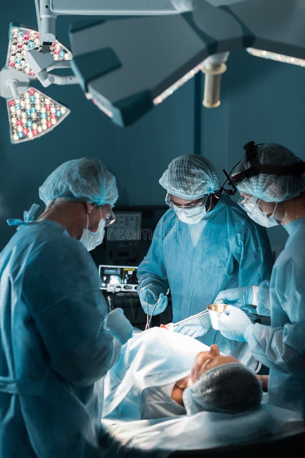 Surgeons in Operating Room in Emergency Stock Photo - Image of ...