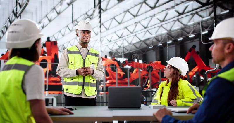 Multiethnic Team of Engineers Discussing Production Stock Image - Image ...