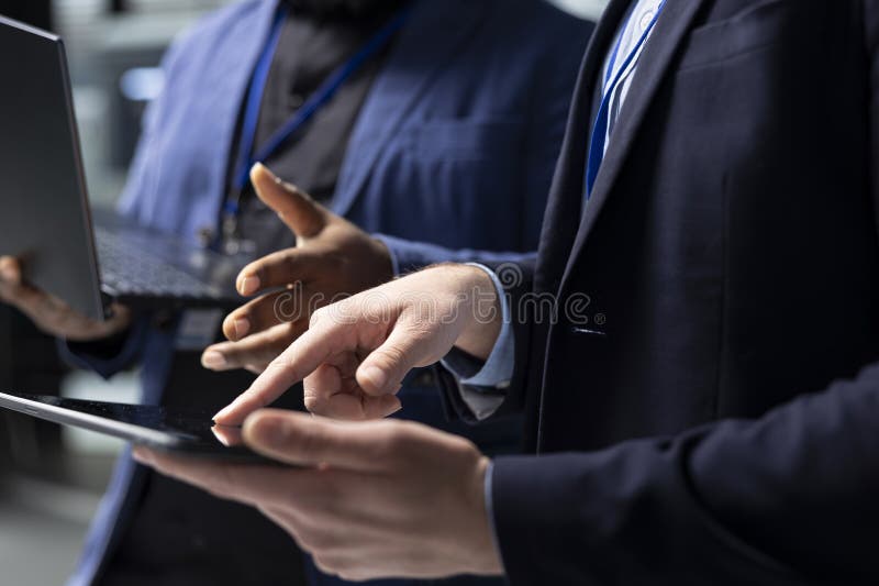 Multiethnic Technicians and Building Contractors Group Analyzing Data ...