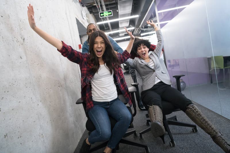 Multiethnics Business Team Racing on Office Chairs Stock Image - Image ...