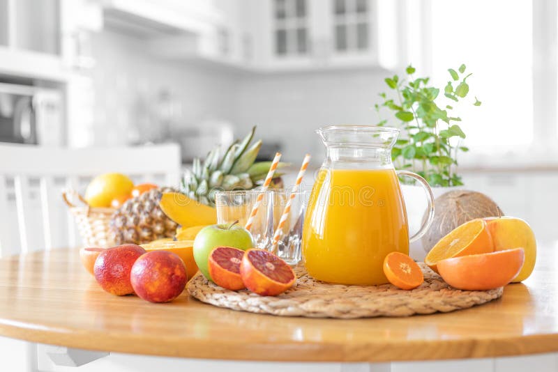 Multifruit Juice and Fresh Fruit on Table on Kitchen Background Stock ...