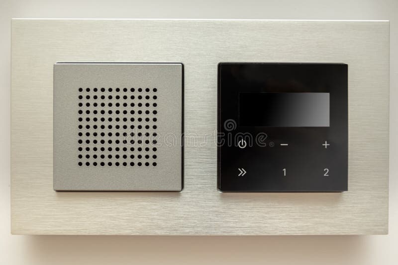 Multifunction Outlet with Speaker and Touchpad on a Wall Stock Photo ...