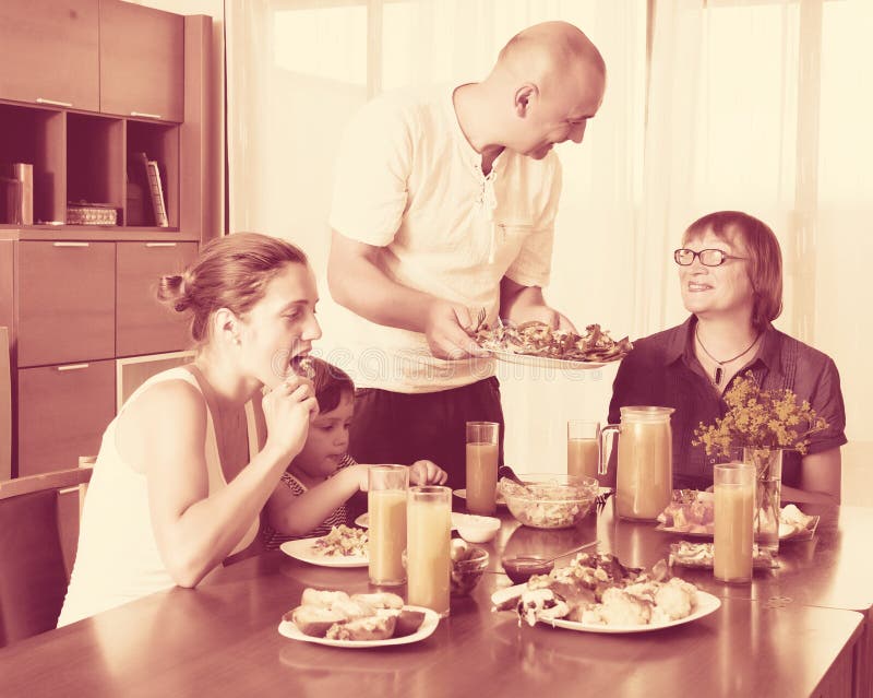 Multigeneration Family Eating at Home Stock Image - Image of daughter ...