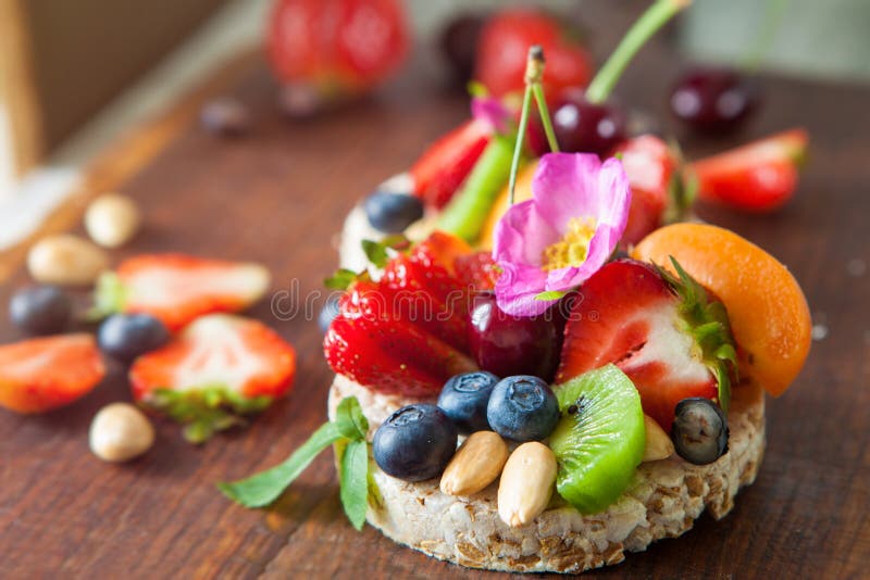 Multigrain Rice Cakes with Berries, Fruit and Almond for Healthy Stock ...