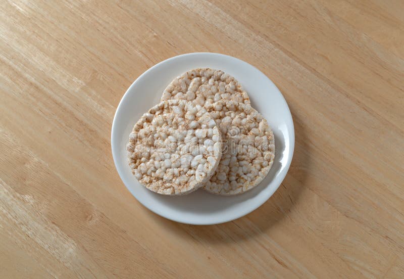 Multigrain Rice Cakes on Wood Table Stock Image - Image of plate ...