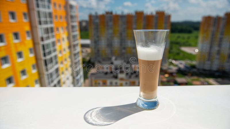 Multilayer Coffee on a White Windowsill Overlooking the City Stock ...