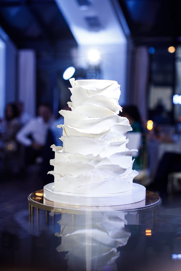 Multilevel Wedding Cake on a Metal Table Stock Image - Image of tasty ...